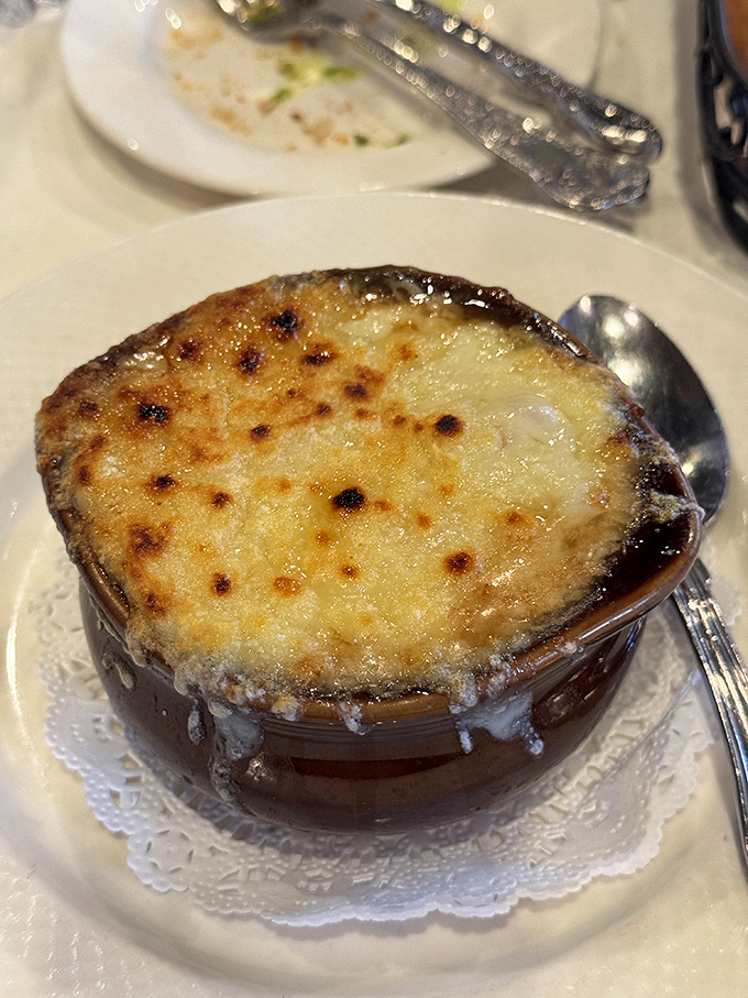 This isn't just soup&mdash;it's a commitment to excellence. The caramelized onions beneath that magnificent cheese cap have been simmering their way to perfection for hours.