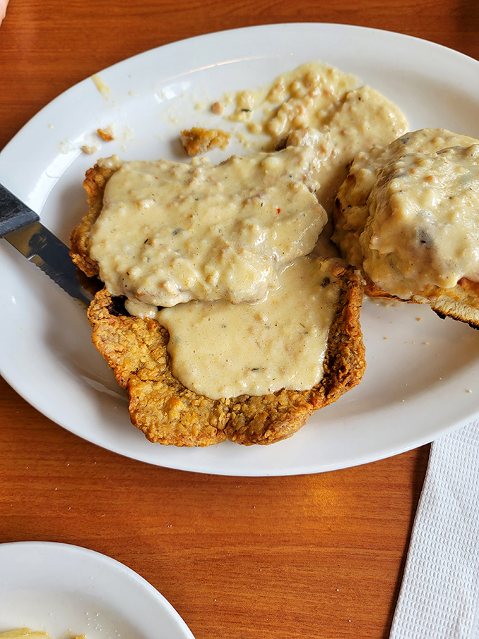 This chicken fried steak isn't just dinner, it's an engineering marvel &ndash; crispy exterior, tender interior, and gravy that should have its own fan club.