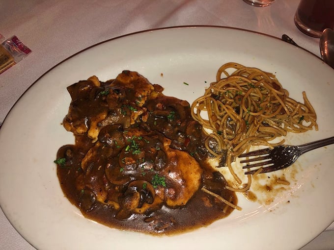 Chicken Marsala with a sauce so rich it probably owns beachfront property. The mushrooms have found their forever home.