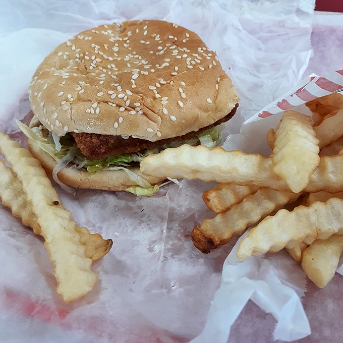 Crispy on the outside, juicy within—this chicken sandwich proves simplicity triumphs over gimmicks. Pair with those crinkle-cut fries for maximum happiness.