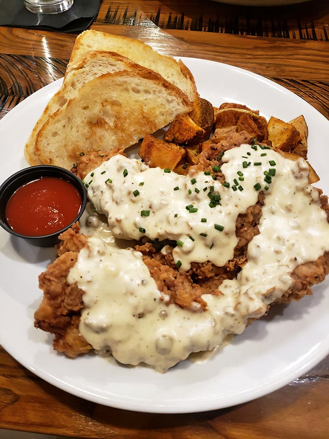 Southern comfort reimagined: chicken fried pork tenderloin smothered in country gravy. Your cardiologist won't approve, but your soul certainly will.