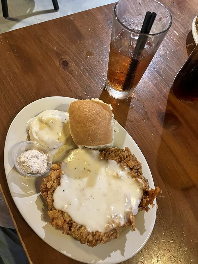 This isn't just dinner&mdash;it's an edible hug from the Heartland. The chicken fried steak practically disappears under that river of gravy, keeping company with mashed potatoes that clearly never came from a box.