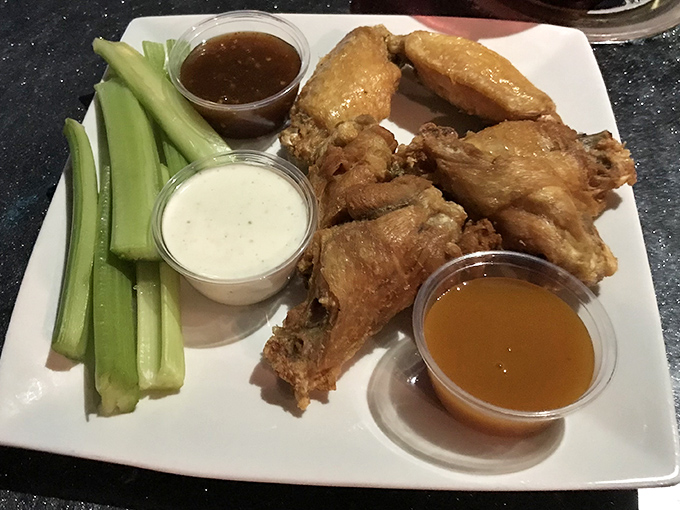 Wings so good they might make you believe in flying saucers, served with multiple dipping sauces for your earthly enjoyment.