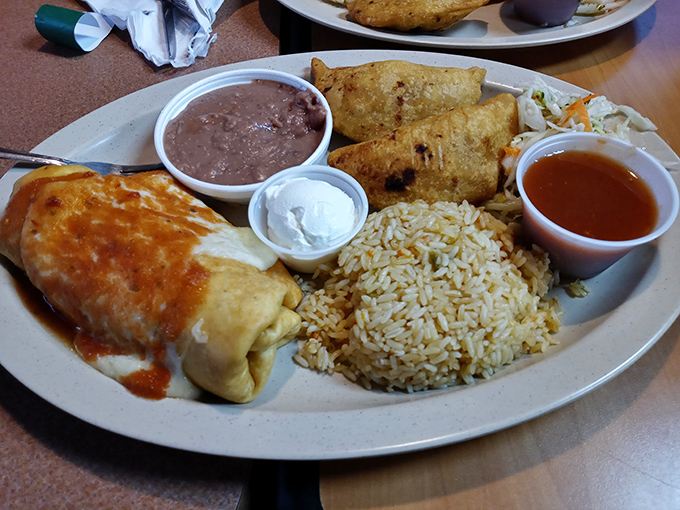 The chimichanga doesn't just arrive&mdash;it makes an entrance. Draped in sauce, accompanied by perfectly seasoned rice and refried beans, it's the Beyonc&eacute; of the plate. 
