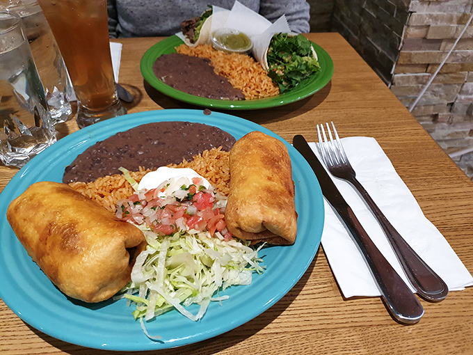 The chimichanga twins, crispy on the outside and tender within, sit like honored guests on colorful plates that brighten even the gloomiest New York day.