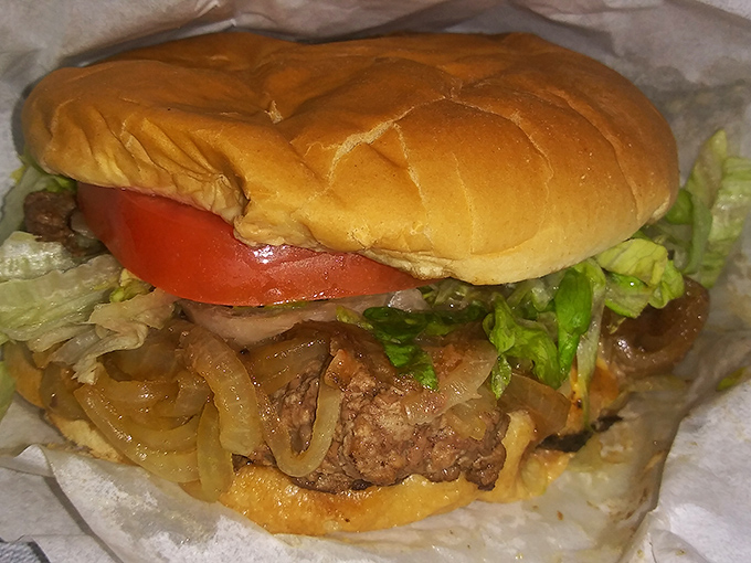 Behold the architectural marvel that is Dan's classic cheeseburger. Those caramelized onions aren't just toppings—they're transformative experiences.