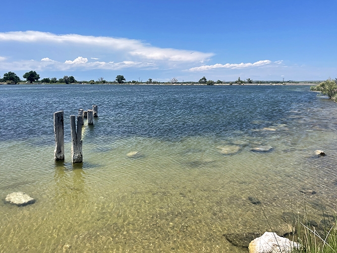 The water's remarkable clarity reveals every pebble below. Swimming here is like floating in nature's version of filtered spring water.