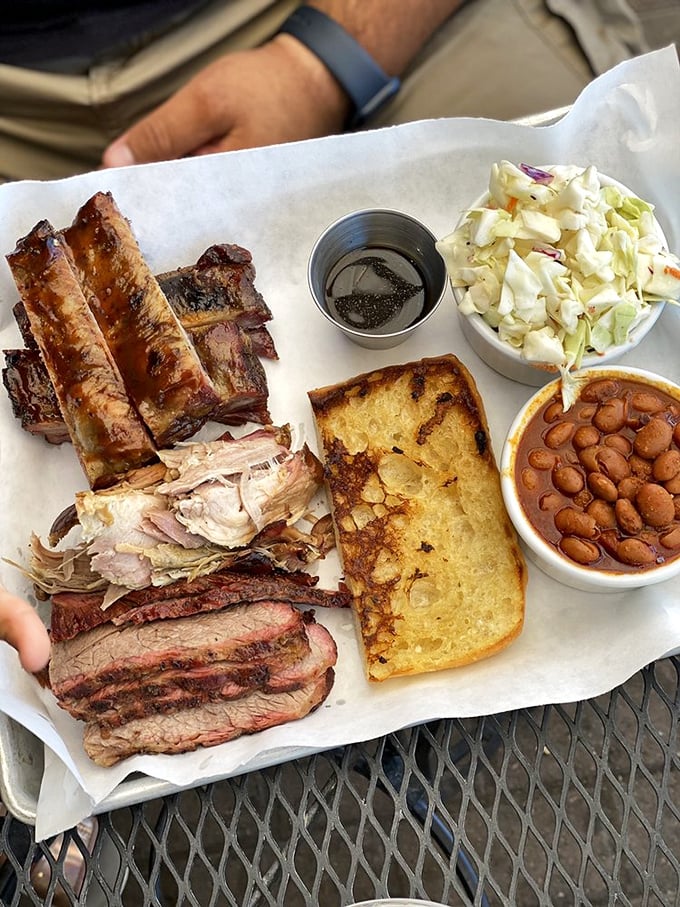 The holy trinity of barbecue: ribs, brisket, and pulled pork. This tray should come with a warning label: "May induce spontaneous happy dances."