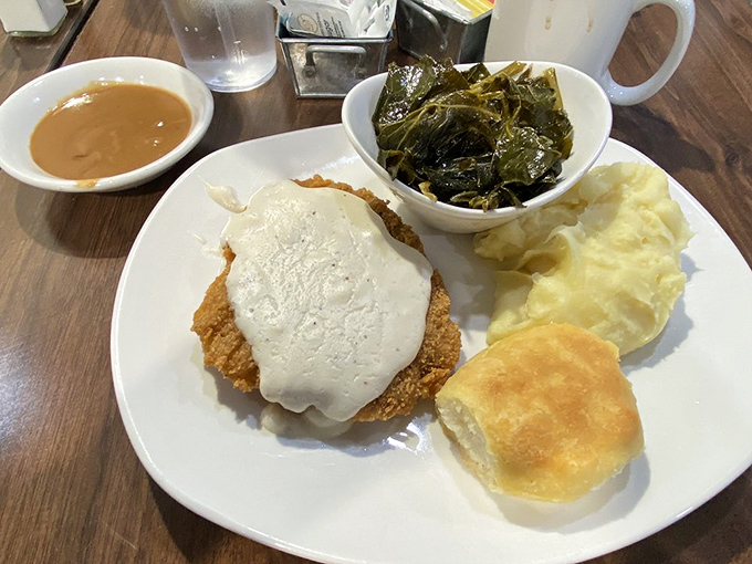 This chicken fried steak doesn't just come with gravy&mdash;it comes with a philosophy: life's too short for diet food when collard greens and homemade biscuits exist.