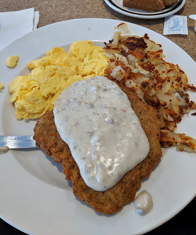 Country fried steak with eggs and hash browns&mdash;the breakfast equivalent of hitting the lottery. That crispy-to-tender ratio is what diner dreams are made of. 