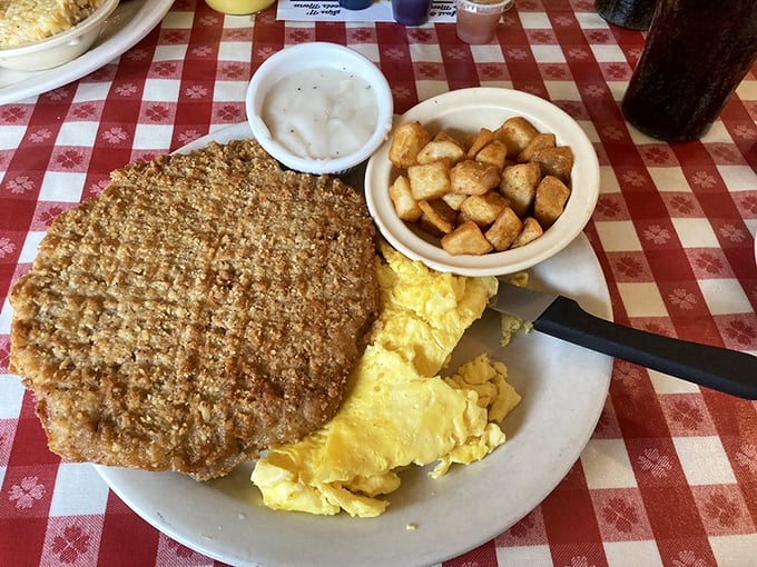 Breakfast of champions: country fried steak, eggs, and hashbrown casserole. The holy trinity of morning indulgence that makes alarm clocks worthwhile.