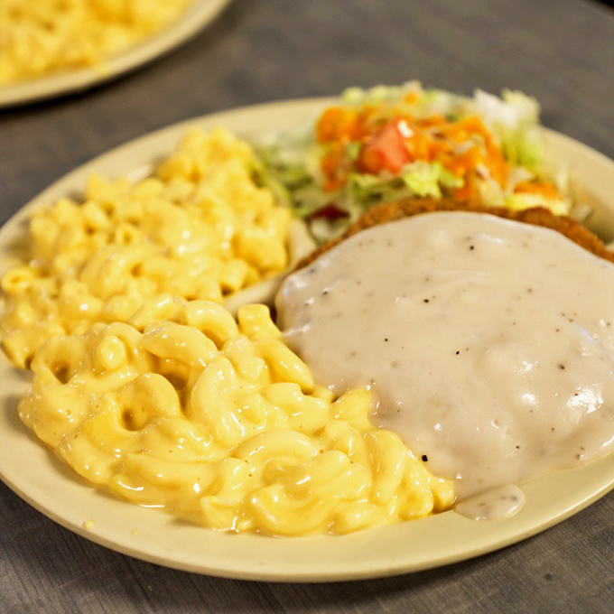 Mac and cheese that doesn't come from a blue box meets country fried steak that doesn't come from a freezer. This is what comfort looks like. 
