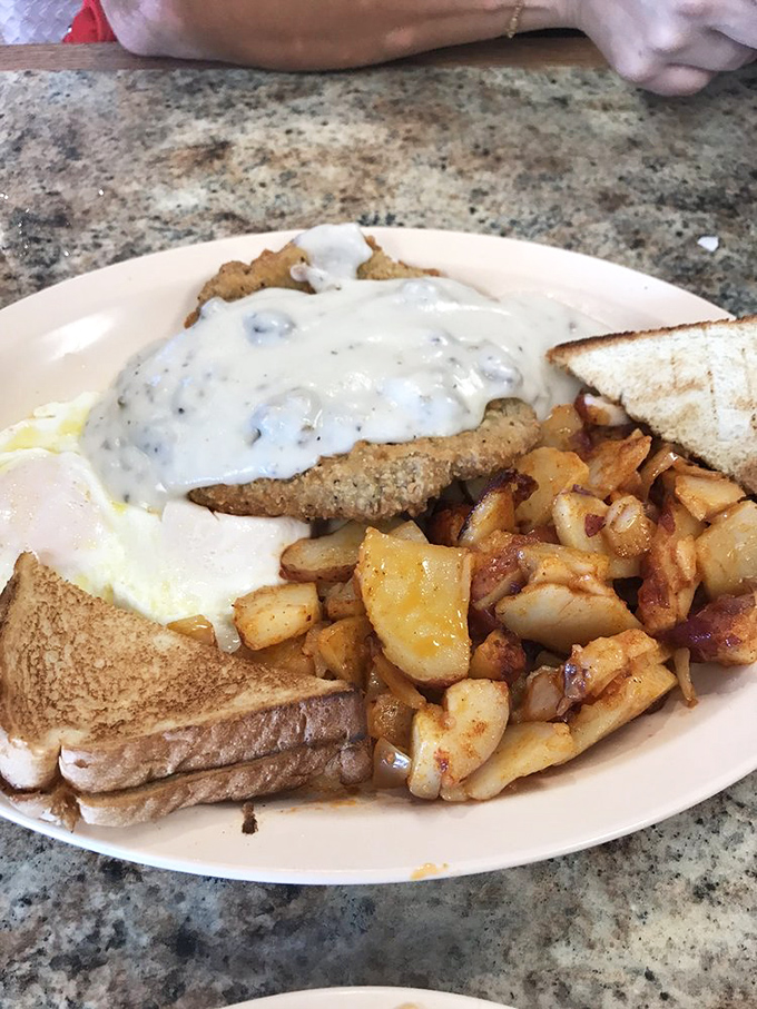 This isn't just country fried steak&mdash;it's edible therapy. Crispy exterior, tender meat, and that gravy could make cardboard taste like a delicacy.