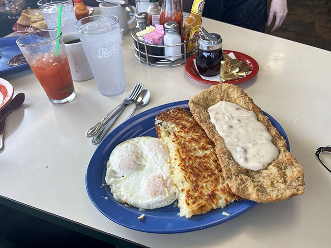 This isn't just country fried steak&mdash;it's edible therapy on a blue plate, with hash browns that achieved the perfect crisp-to-tender ratio scientists still can't explain.