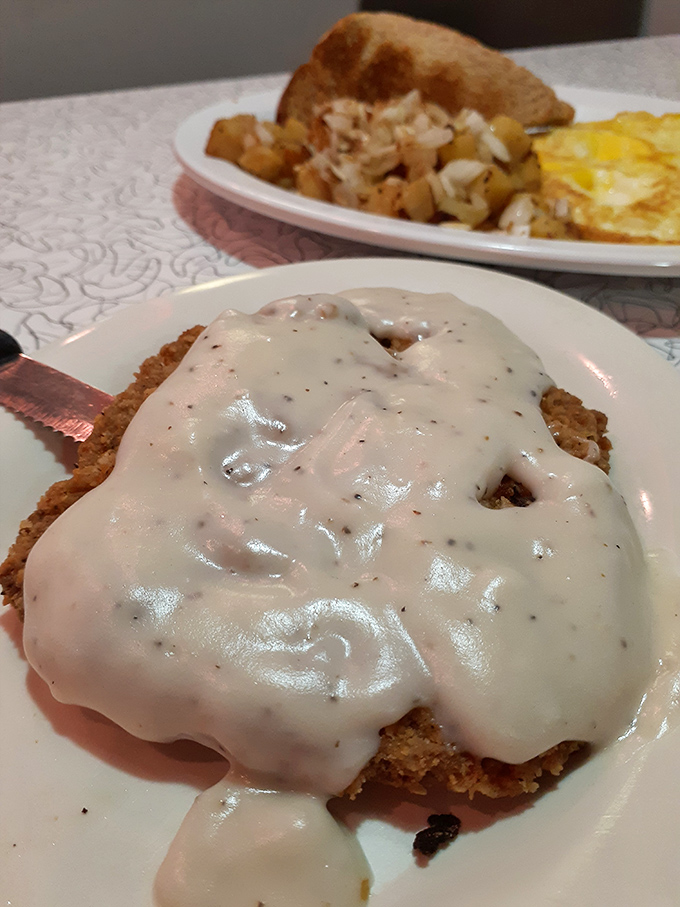 That country fried steak isn't just covered in gravy&mdash;it's having a spa day in it. The kind of meal that makes you want to hug the cook.