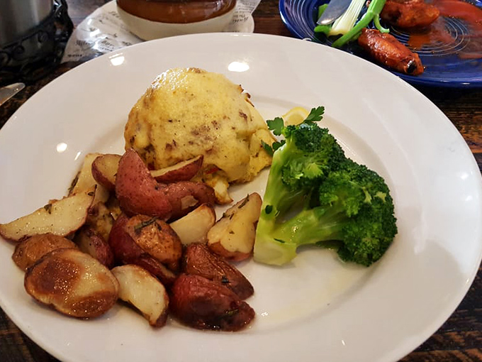 The holy trinity of comfort: a perfectly bronzed crab cake, herb-roasted potatoes, and bright green broccoli. Simple food done extraordinarily well.