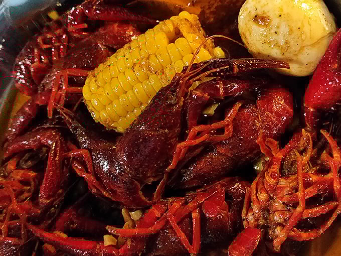 Crawfish, corn, and potatoes swimming in crimson spices. The Louisiana bayou just established an outpost in Kansas City.