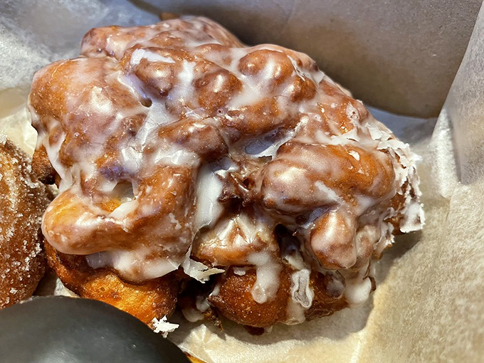Behold the holy grail of fritters – all gooey, glazed nooks and crannies hiding apple treasures like nature's edible treasure map.
