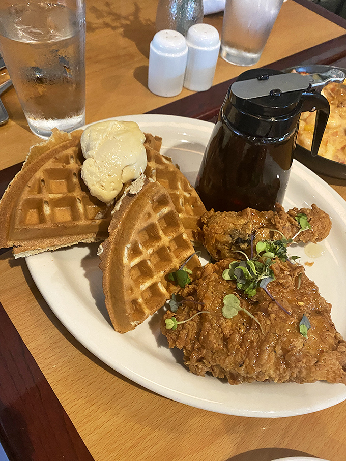 Butter melting into golden waffle divots while crispy chicken stands at attention. This plate doesn't just feed you&mdash;it hugs your soul from the inside out.