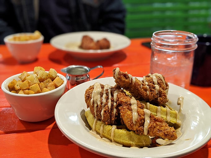 The chicken and waffles arrive with a side of potatoes that aren't just playing backup &ndash; they're auditioning for their own food show.
