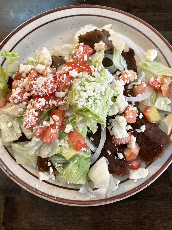 This Greek salad doesn't just accompany the gyro&mdash;it completes it. Crisp lettuce, tangy feta, and juicy tomatoes create the perfect Mediterranean harmony.