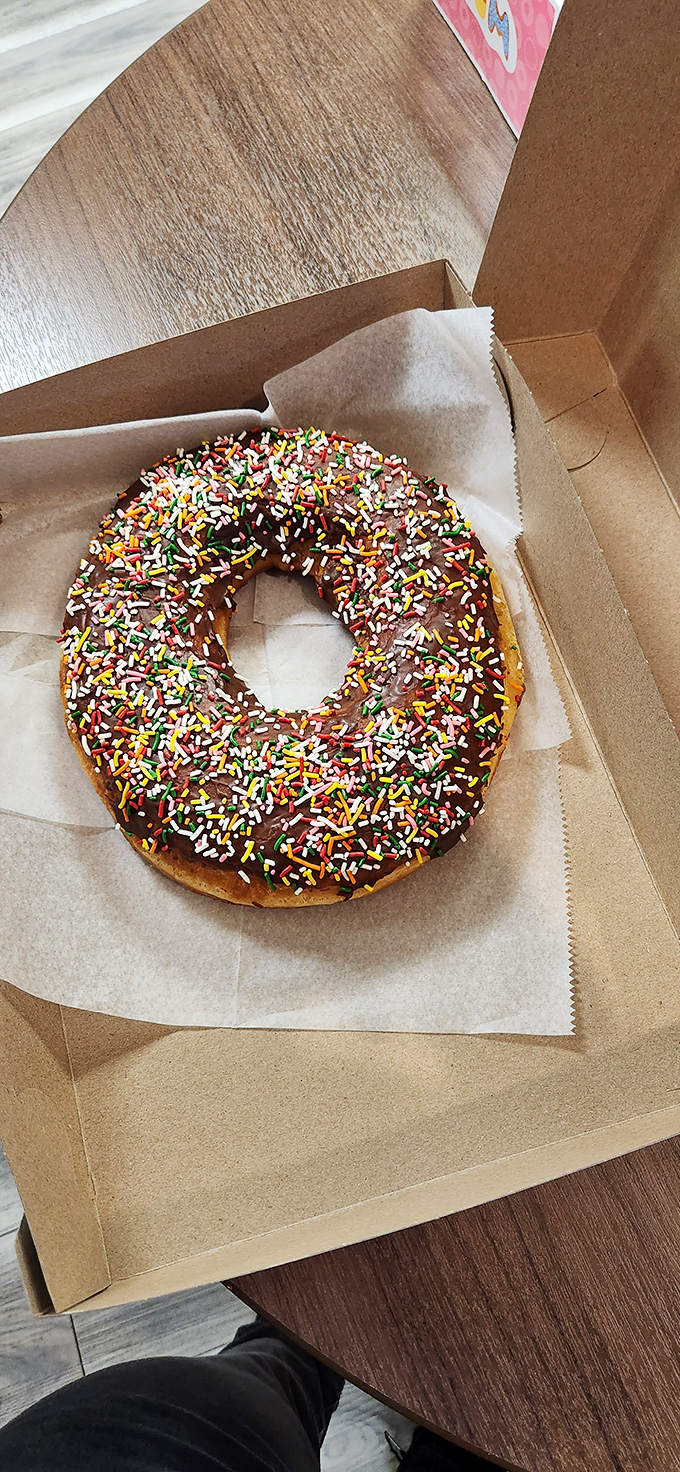 Sprinkles galore on chocolate perfection. This isn't just a donut—it's what Saturday mornings were invented for.