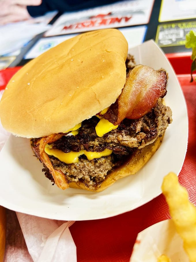 When one patty won't do, the double bacon cheeseburger arrives like a towering monument to carnivorous pleasure.