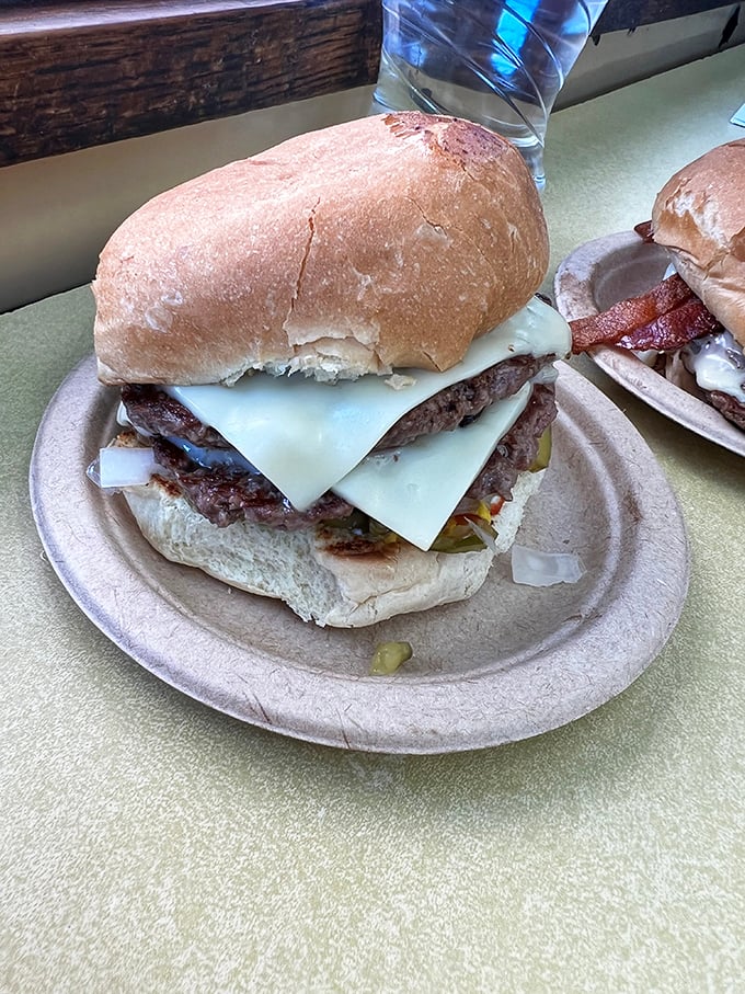 This double cheeseburger isn't trying to impress Instagram—it's too busy preparing to impress your taste buds with melty perfection.