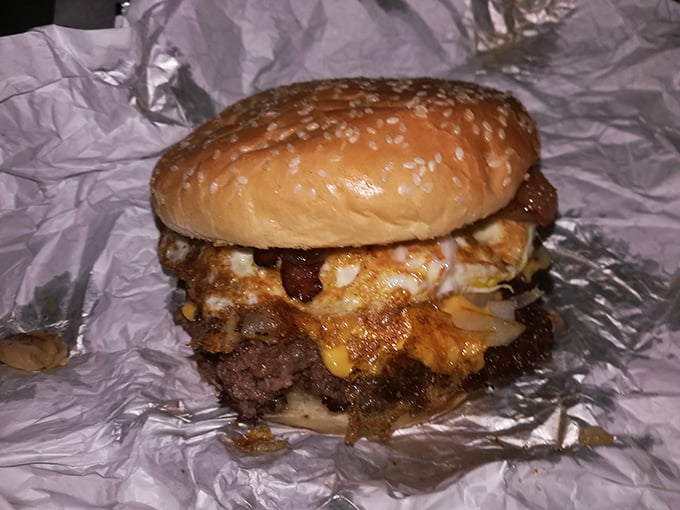 This isn't just dinner—it's an event. The egg adds a silky richness that transforms an already great burger into something transcendent.