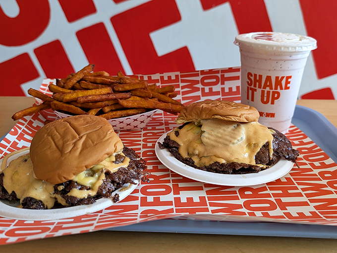 The only thing better than one perfect cheeseburger? Two perfect cheeseburgers with a side of golden fries and a shake.