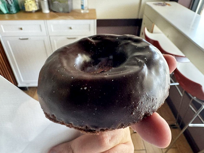 This chocolate donut isn't just wearing chocolate&mdash;it's embraced it as a lifestyle choice. The glossy coating breaks with a satisfying snap between your teeth.