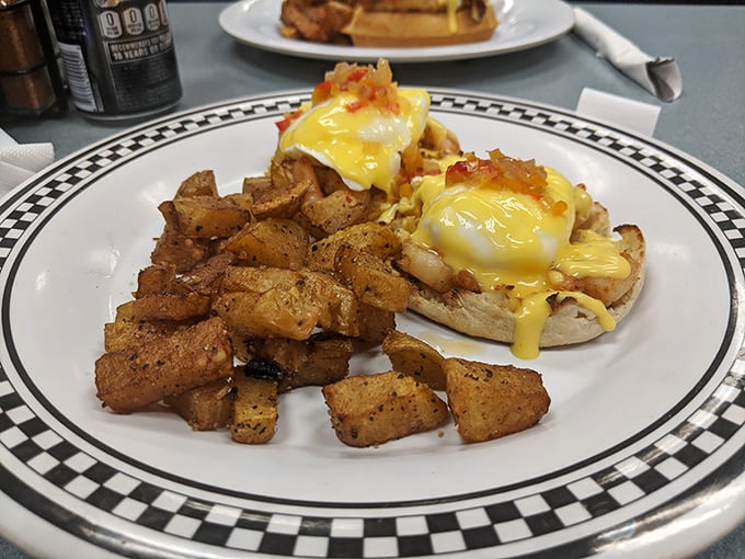 Eggs Benedict: where hollandaise dreams come true. Those perfectly seasoned potatoes aren't just a side dish—they're an essential supporting character in this breakfast drama.