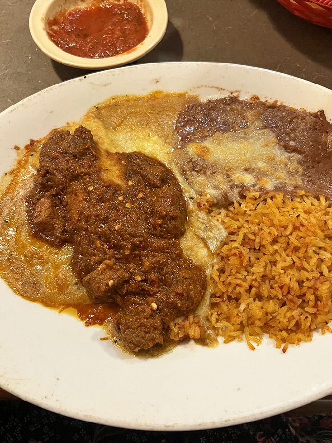 When beef, sauce, and cheese come together this beautifully, it's not just dinner&mdash;it's edible architecture with a side of Mexican rice.
