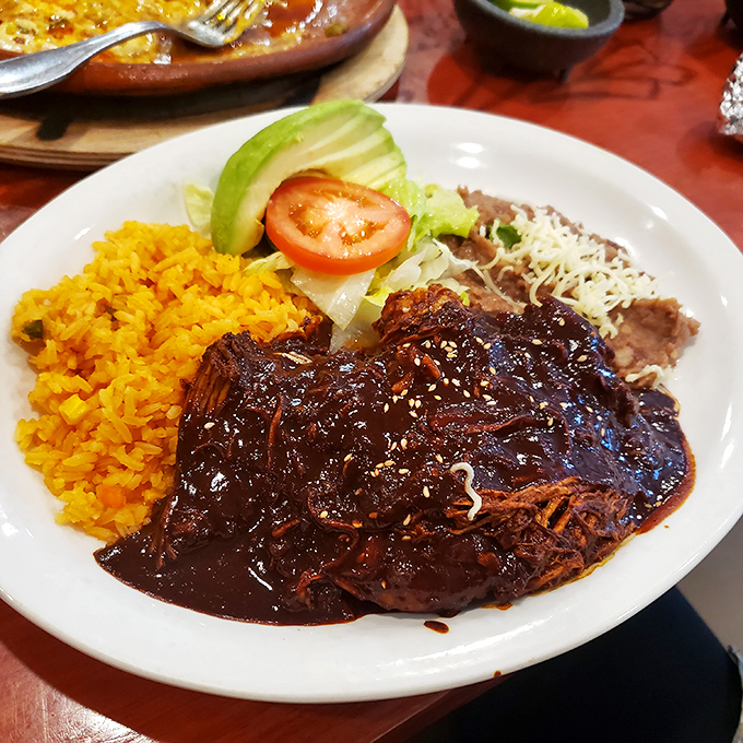 Mole sauce so rich and complex it deserves its own Netflix documentary, paired with perfectly tender beef that melts faster than my willpower.