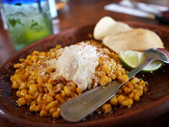 Esquites&mdash;street corn elevated to art form. The creamy, tangy, slightly spicy kernels topped with cotija cheese make vegetables actually worth getting excited about.