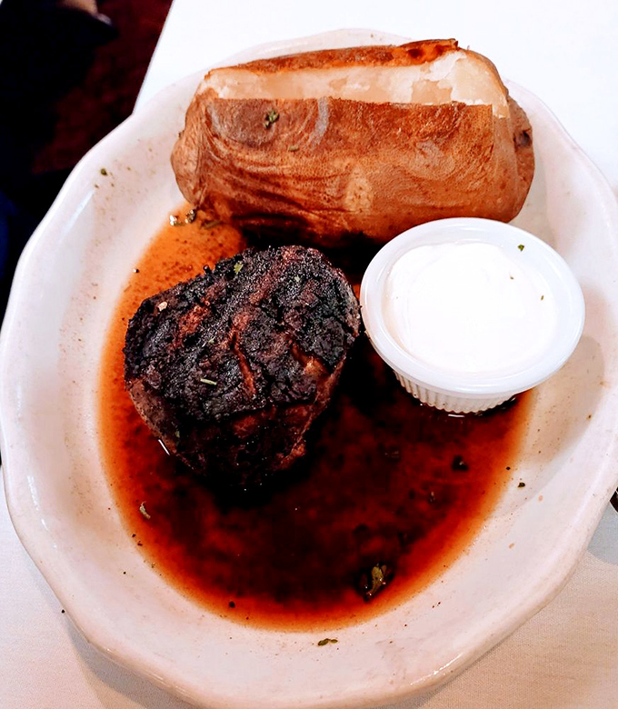 A filet mignon and baked potato—proof that simplicity executed perfectly needs no flashy introduction. The sear speaks for itself.