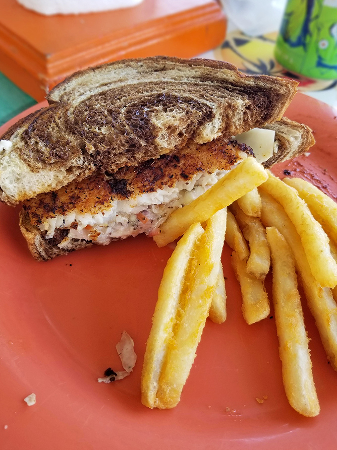 The fish sandwich in its natural habitat&mdash;surrounded by golden fries on a coral plate. A perfect marriage of land and sea.