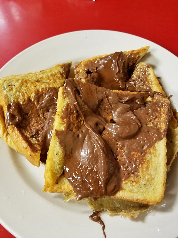 Nutella-slathered French toast that transforms an ordinary morning into a celebration. This isn't breakfast; it's dessert with permission slips signed by grown-ups.