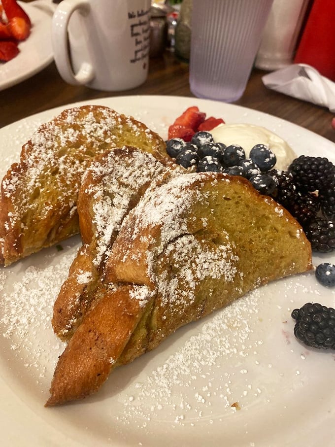 French toast that's achieved celebrity status, complete with berry entourage and powdered sugar confetti. This isn't breakfast&mdash;it's an event.