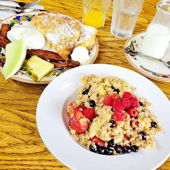 A breakfast spread that makes you want to high-five the chef. Fresh fruit, powdered sugar, and what appears to be the world's most perfect French toast.