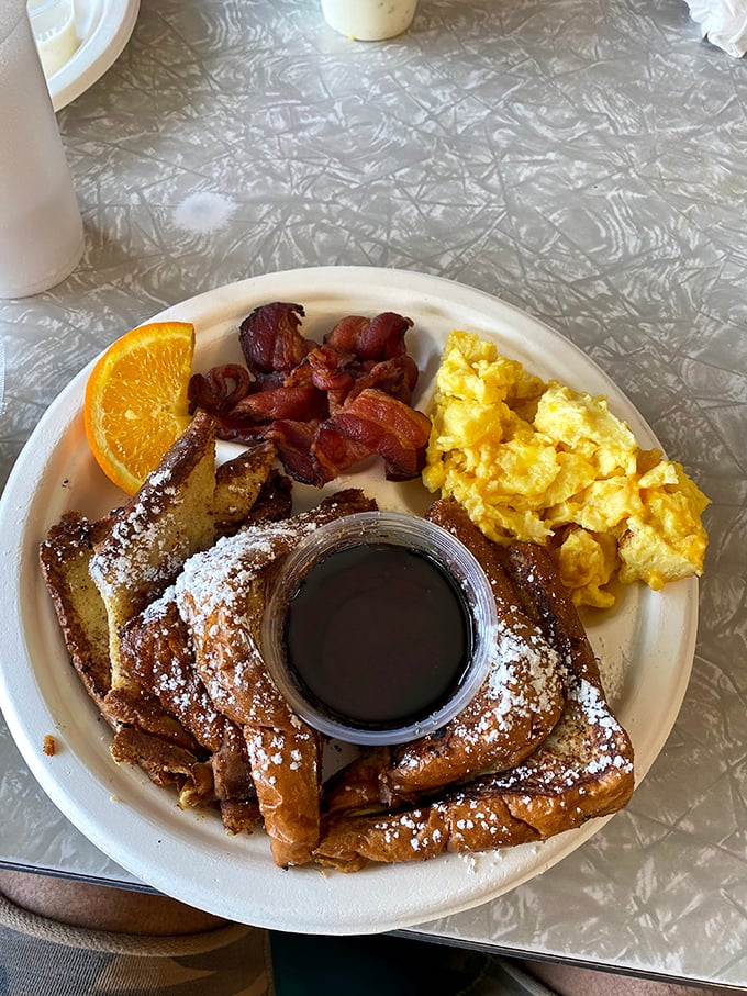 This French toast looks like it graduated from the "How to Make People Swoon" academy, complete with crispy bacon and fluffy eggs.