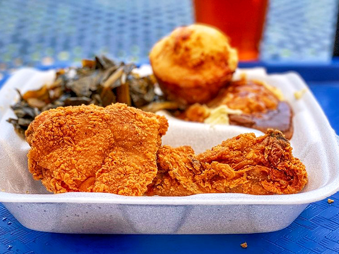 Golden-brown fried chicken with a crust so perfect it deserves its own fan club. The collards and cornbread complete this holy trinity.