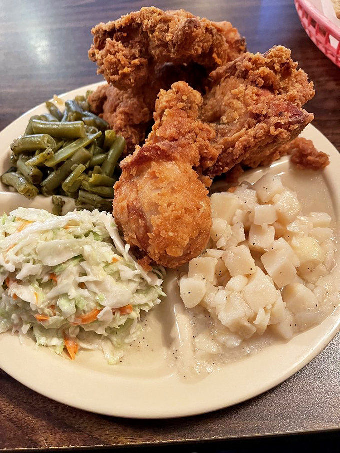 The holy trinity of comfort food: crispy chicken, tender green beans, and sides that make you forget you ever knew what kale was.