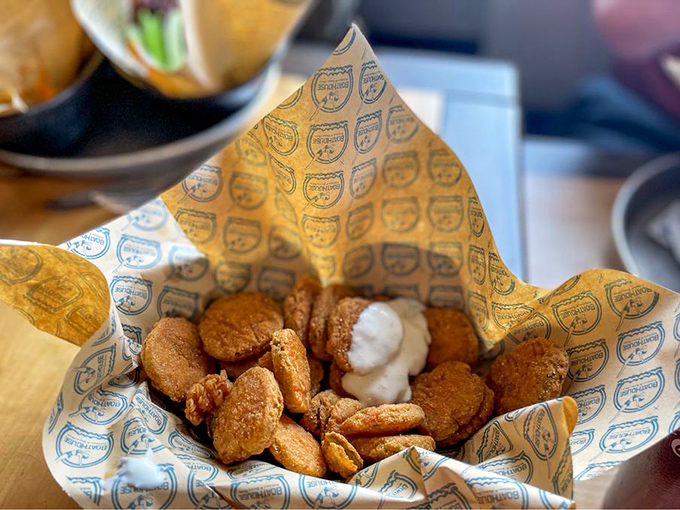 These aren't your average pickles – they're golden-fried treasures with a satisfying crunch that makes ordinary dills green with envy.