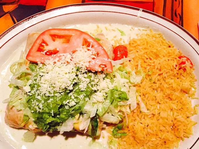 This chimichanga isn't just fried—it's transformed into a golden-brown treasure chest filled with savory secrets and topped with melty cheese.