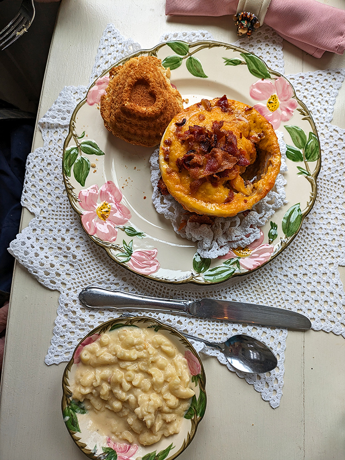 A golden-crowned frittata and creamy mac and cheese served on floral china&mdash;because sometimes breakfast should feel like dining with the Queen of Hearts.