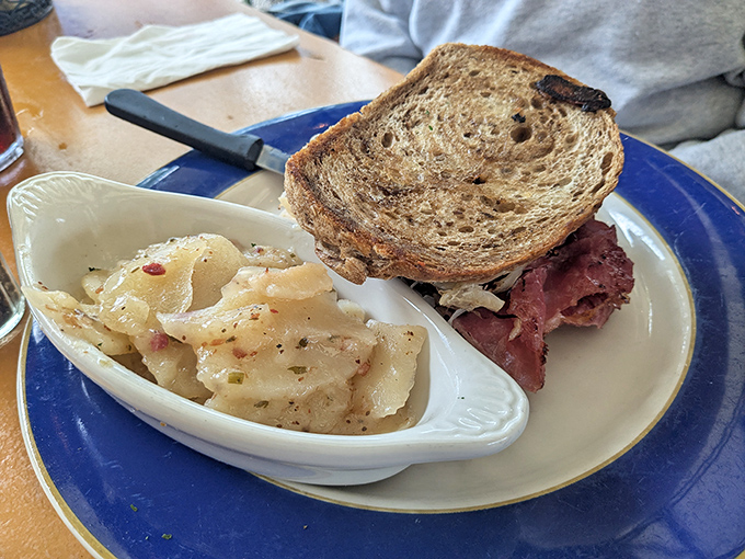 The ultimate power couple: tangy German potato salad and a hearty Reuben. Like Batman and Robin, if they were delicious and didn't fight crime.