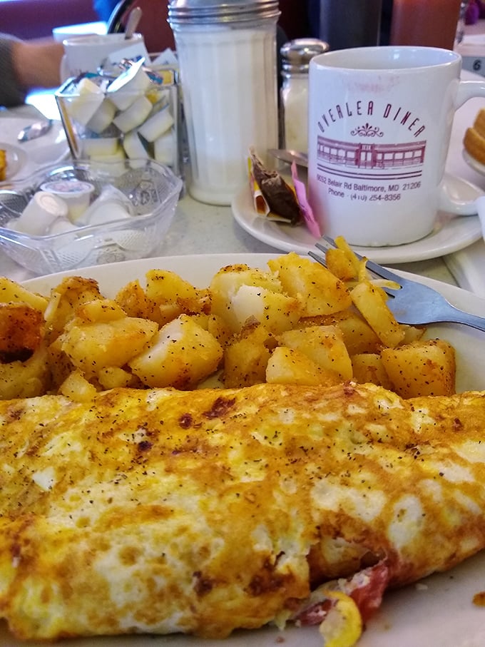 This isn't just breakfast; it's edible therapy. A perfectly executed omelet with home fries that could make a potato farmer weep with pride.