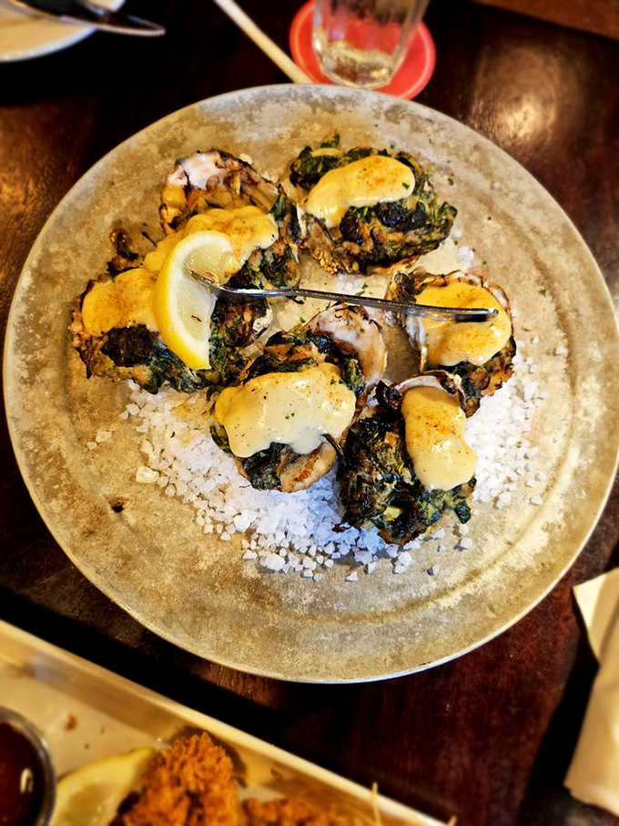 Chargrilled oysters that would make New Orleans jealous. The melted cheese and herbs create a symphony of flavors on each half shell.