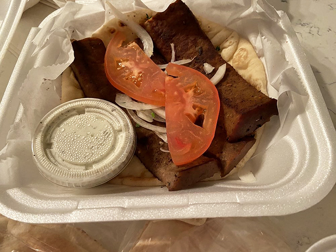 Meat, meet destiny. This to-go gyro doesn't need fancy plating to showcase its perfect balance of savory meat, fresh tomatoes, and creamy sauce.